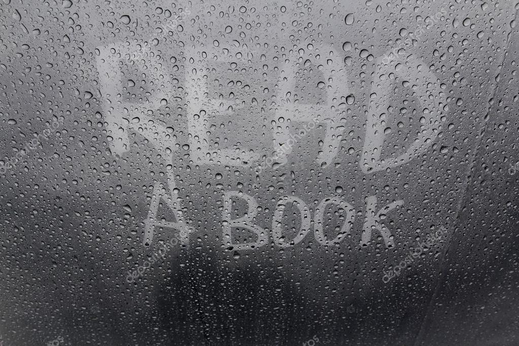Read a book in rainy day Stock Photo by ©mato181 74408311