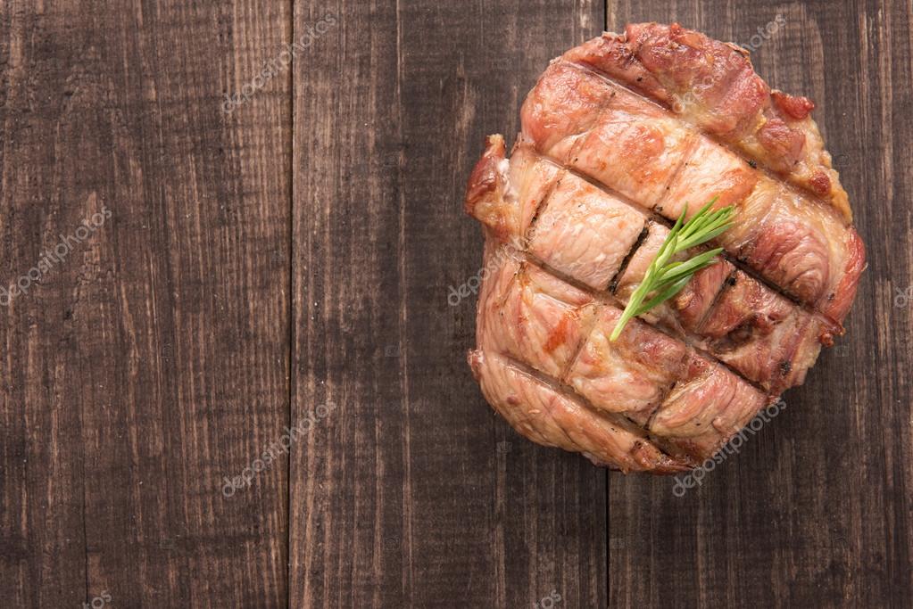 Top view grilled beef steak on a wooden background Stock Photo by ...