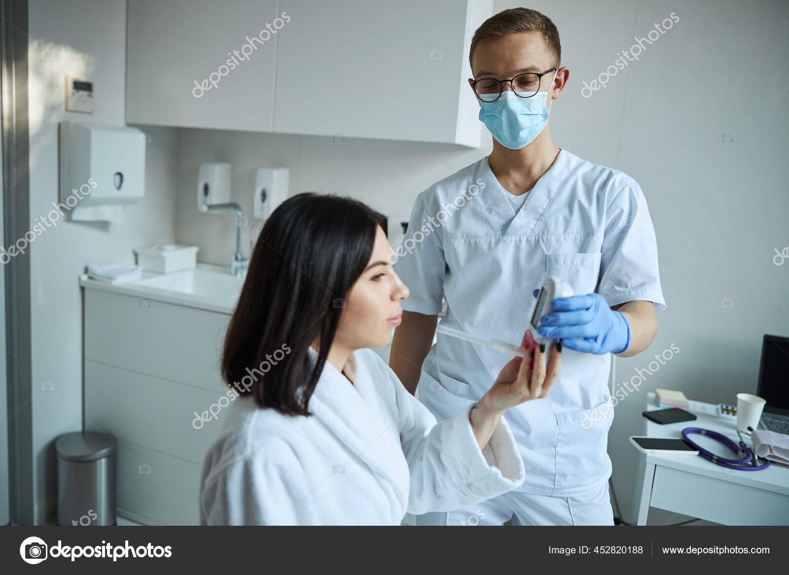 Woman taking a routine spirometry test helped by a physician Stock ...