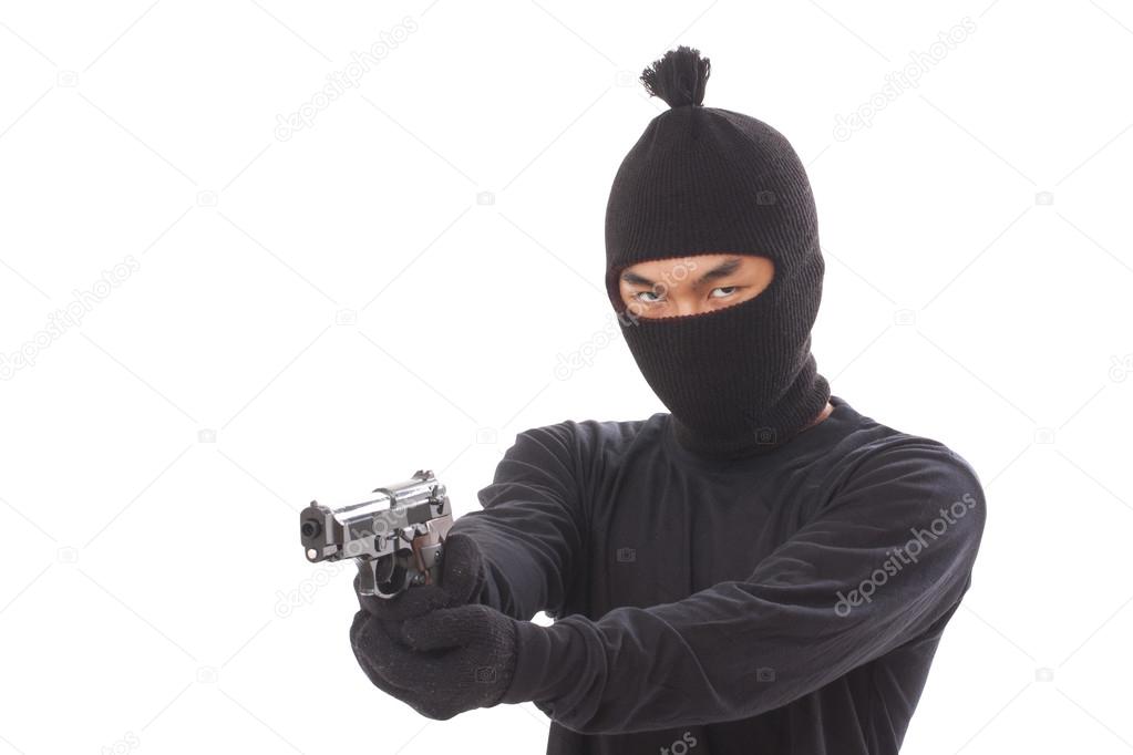 Man in a mask with a gun on a white background Stock Photo by ...