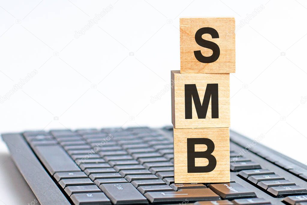 smb in 3d wooden alphabet letters on a keyboard background with copy ...