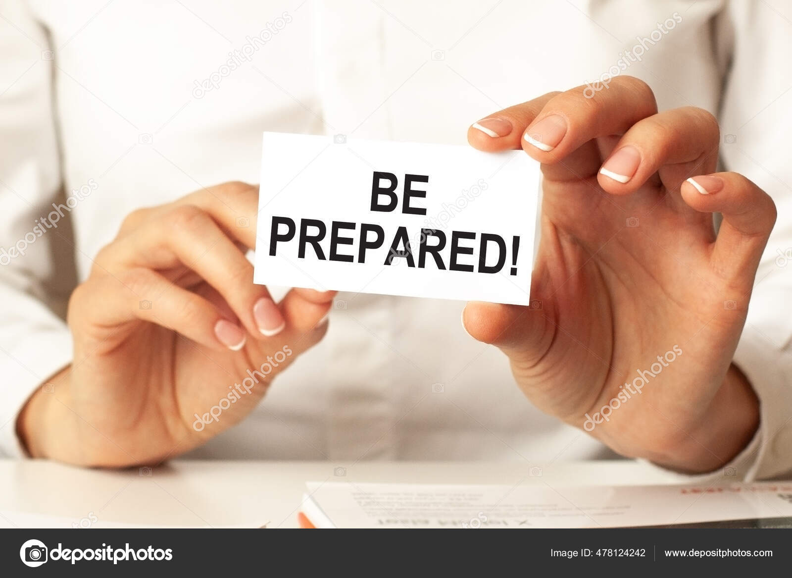 BE PREPARED, message on business card shown by a woman Stock Photo by ...