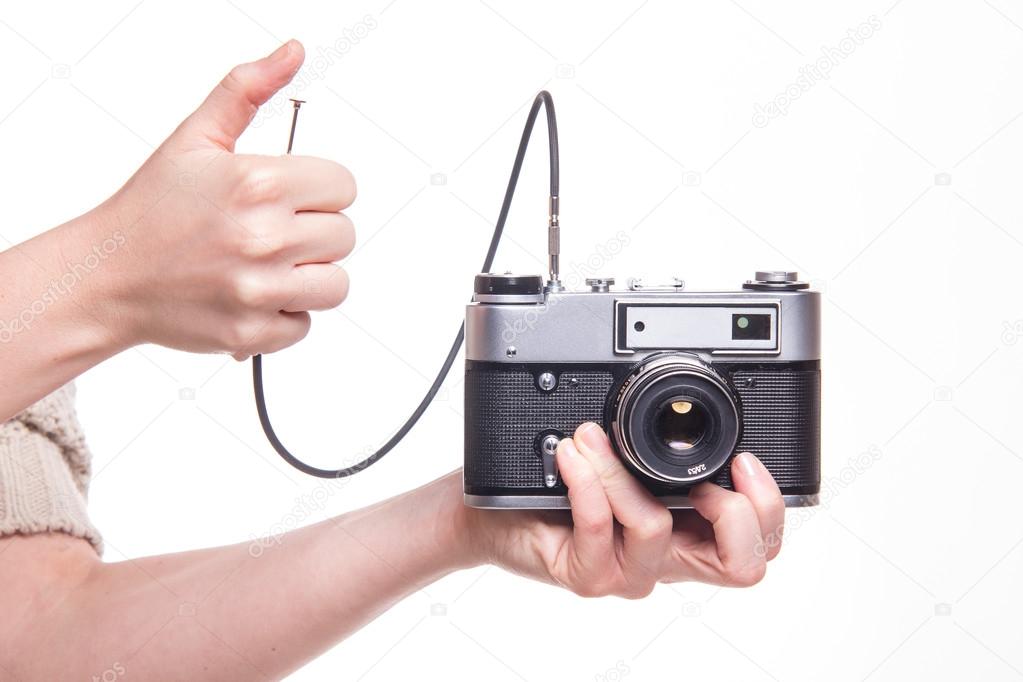 Analog camera with cable release and hand — Stock Photo ...
