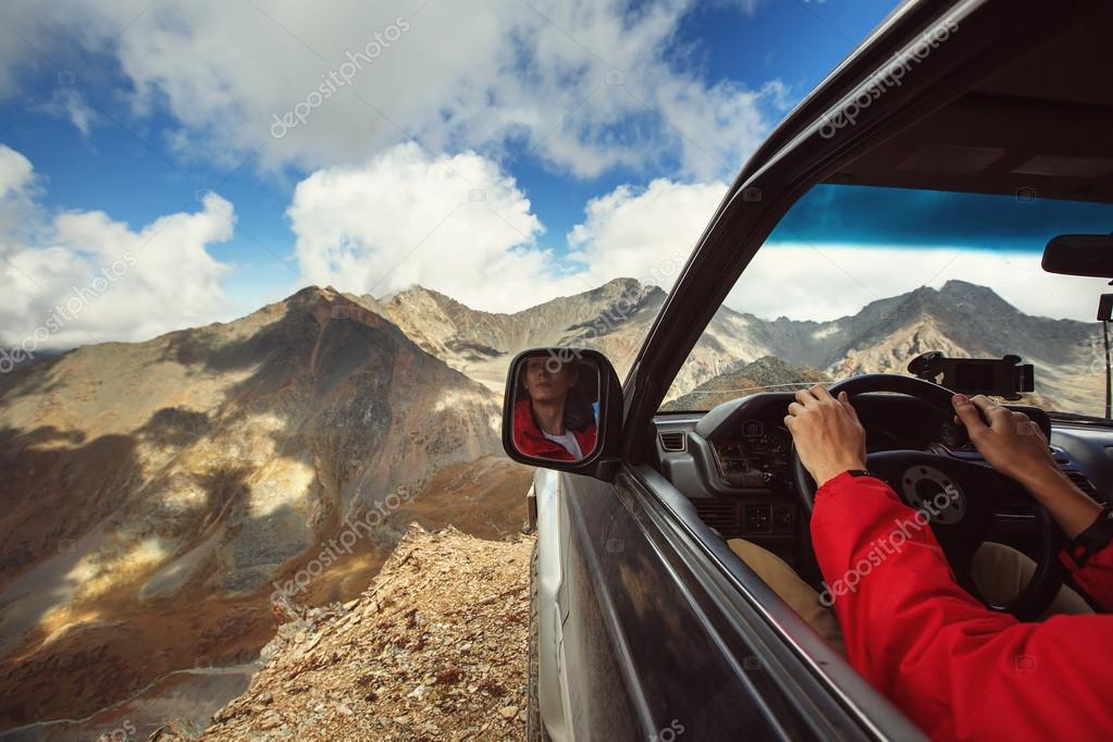 Driver in car on the edge of cliff — Stock Photo © AnnaTamila #93635740