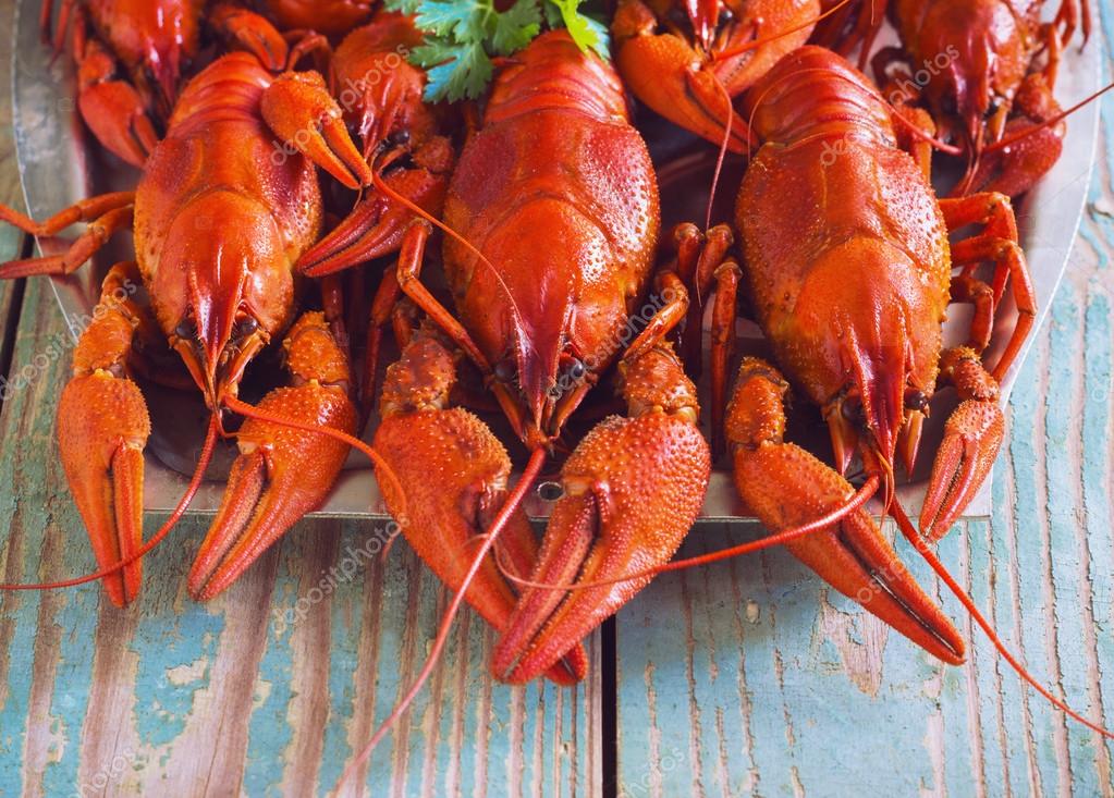 Crawfish on wooden background Stock Photo by ©OksanaYasiuchenia 84879262