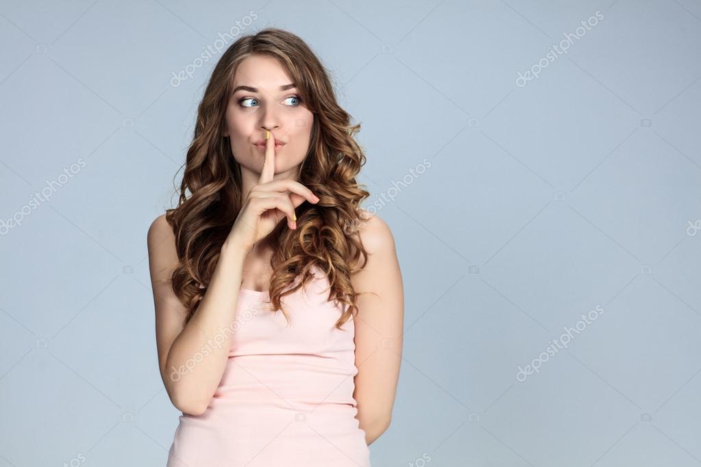 Secret woman. Female showing hand silence sign — Stock Photo ...