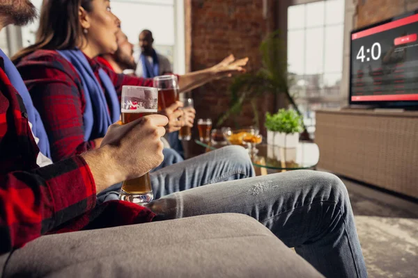 TV screen with mobile app for betting and score, cheering friends, fans ...