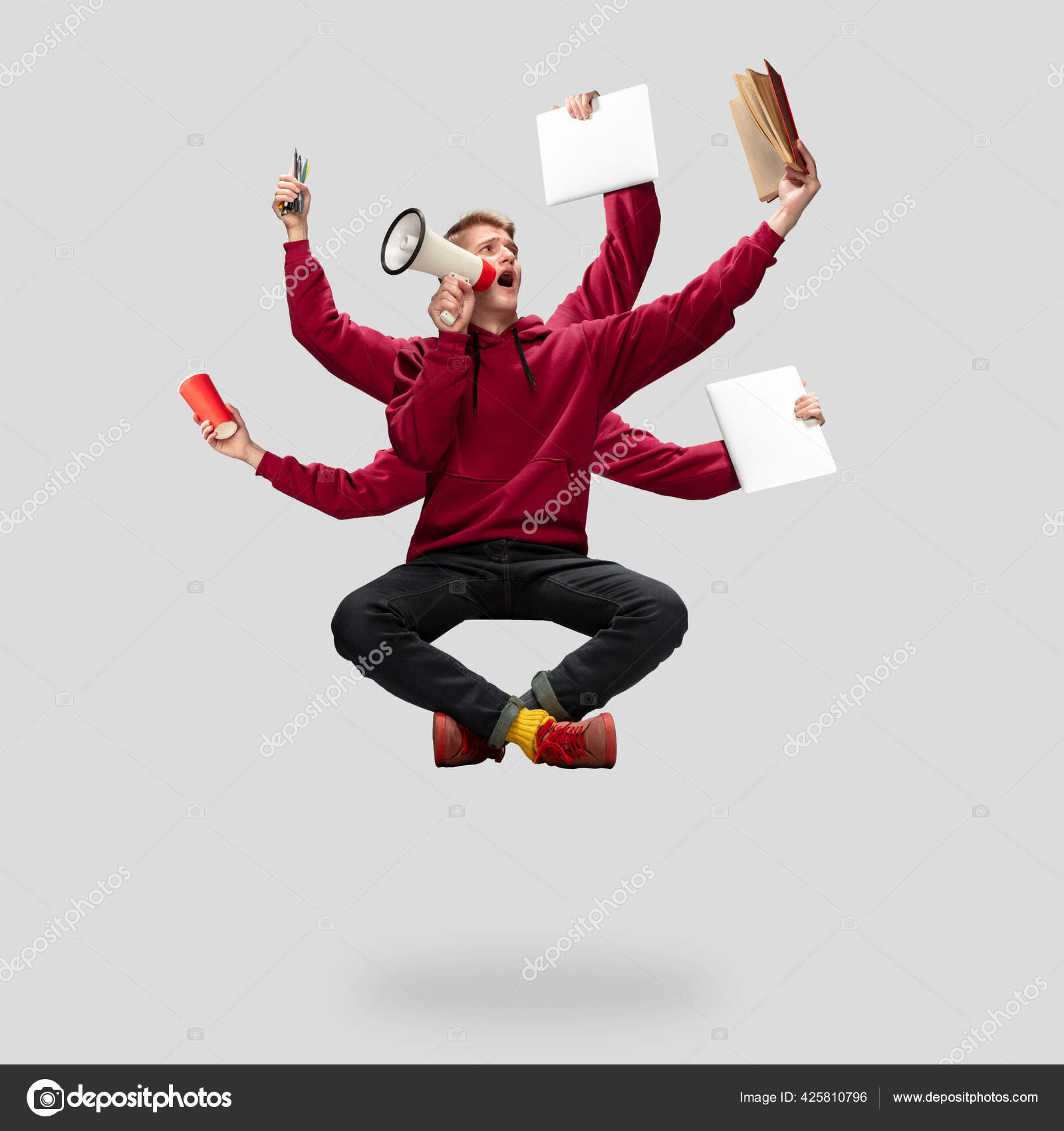 Handsome multi-armed student levitating isolated on grey studio ...