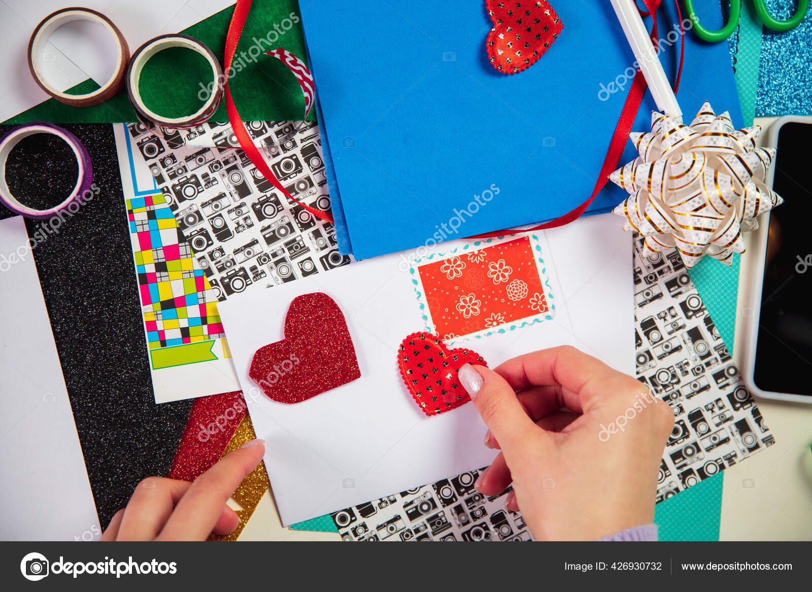 Woman making greeting card for New Year and Christmas 2021 for friends ...