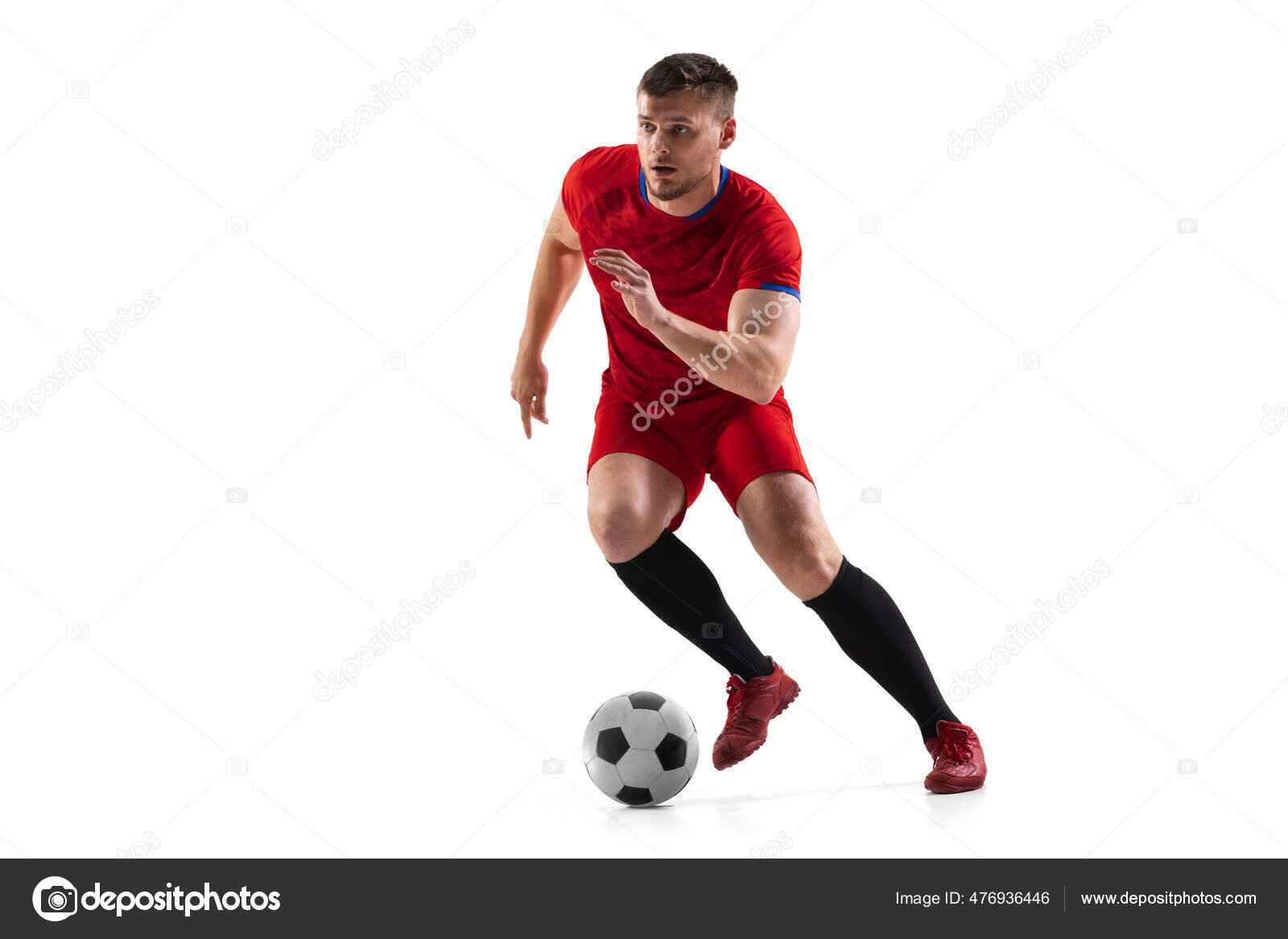 Powerful, flying above the field. Young football, soccer player in ...