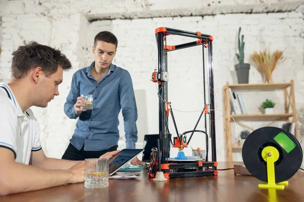 New generation of 3D Printing Machine printing a piece of plastic. For ...