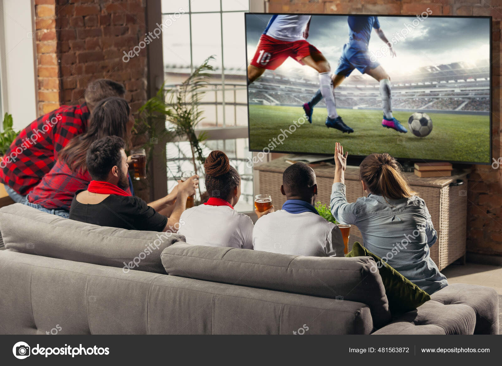 Family Watching Soccer On Tv