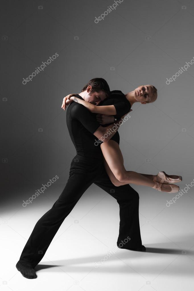 Two young modern ballet dancers on gray studio background — Stock Photo ...