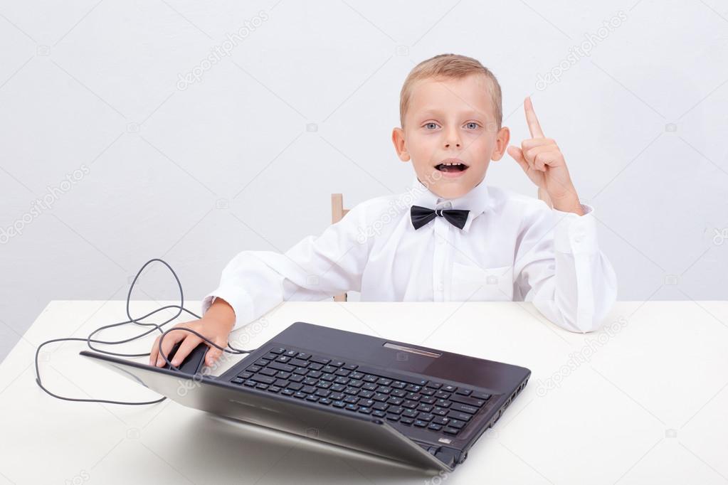 Boy using his laptop computer Stock Photo by ©vova130555@gmail.com 81878018