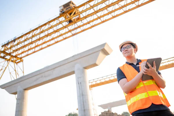 Smart Asian worker man or male civil engineer with protective safety ...