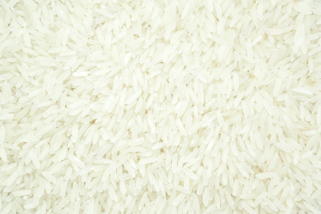 Thai white rice grain texture Stock Photo by ©zephyr18 83150758