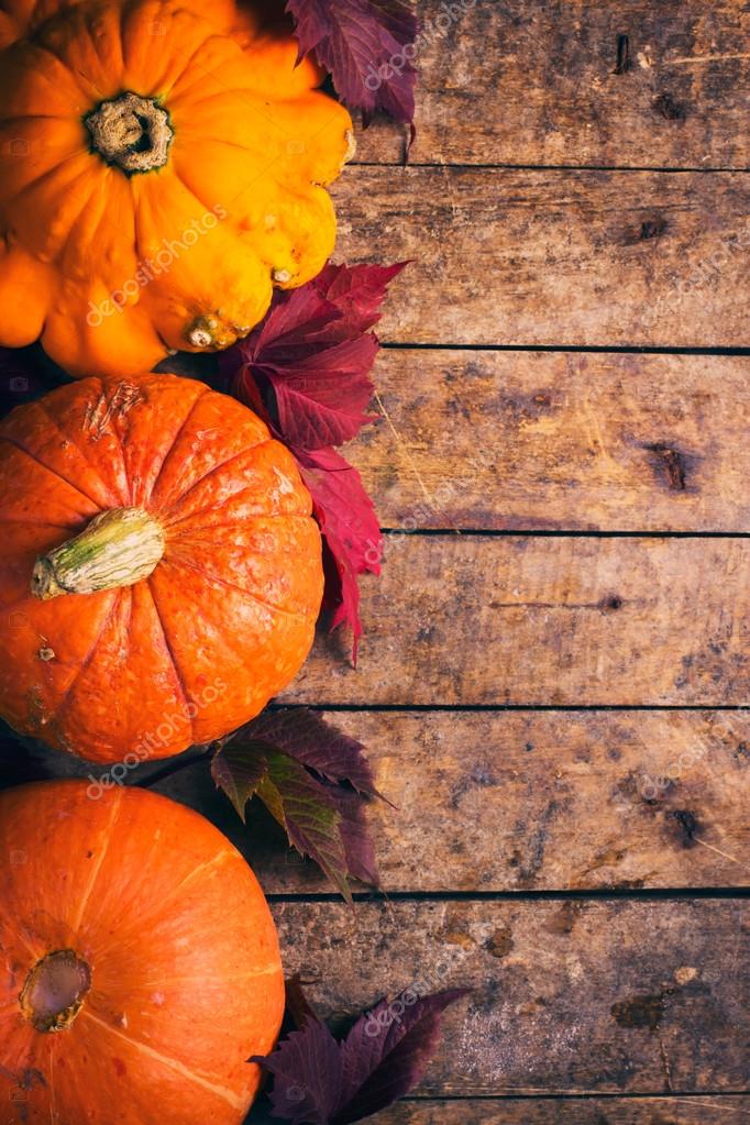 Autumn food background with pumpkins and colored leaves — Stock Photo ...