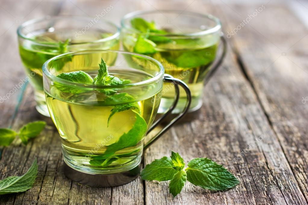 Hot mint tea in glass cup Stock Photo by ©Anna_Shepulova 84495554