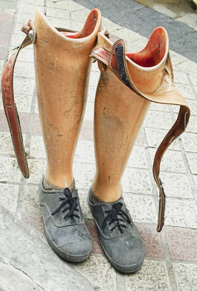 Old prosthetic legs set on a cement floor — Stock Photo © VICHAILAO ...