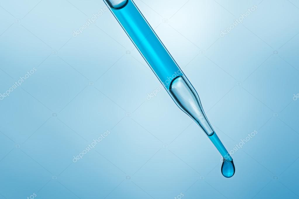 Science laboratory pipette with a drop of chemical — Stock Photo ...