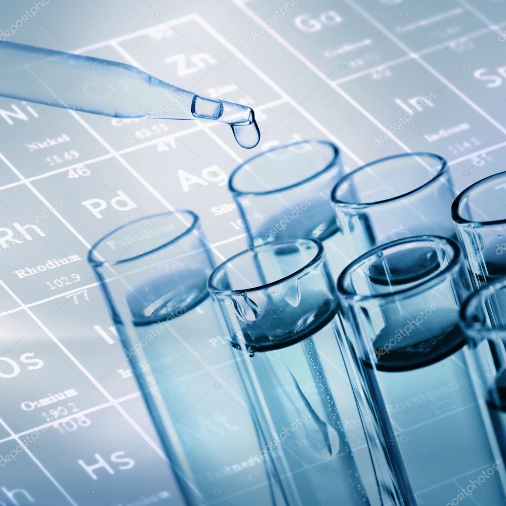 Science laboratory test tubes with periodic table background Stock ...