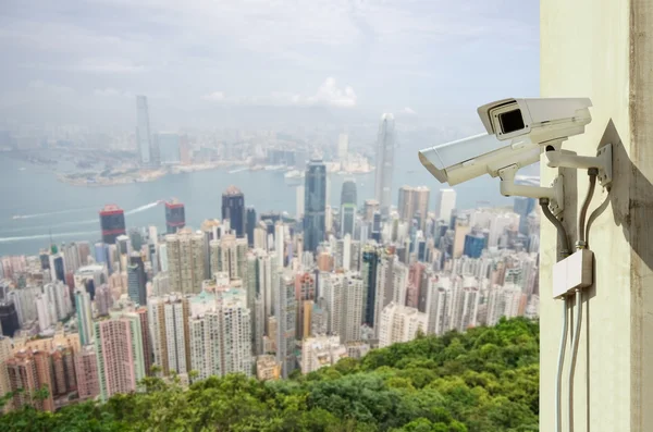 Surveillance Security Camera or CCTV over city Stock Photo by ...
