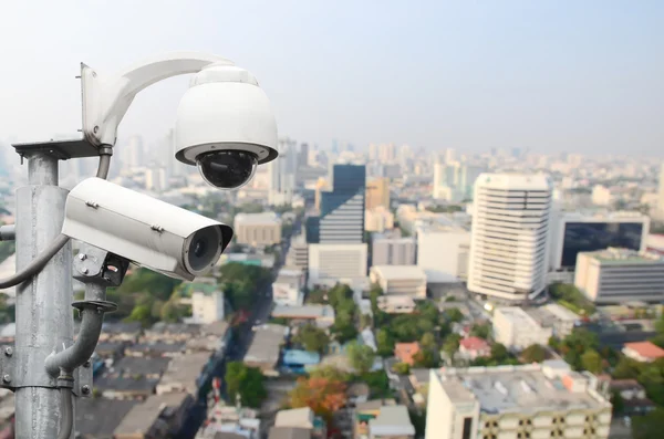 Surveillance Security Camera or CCTV over city Stock Photo by ...