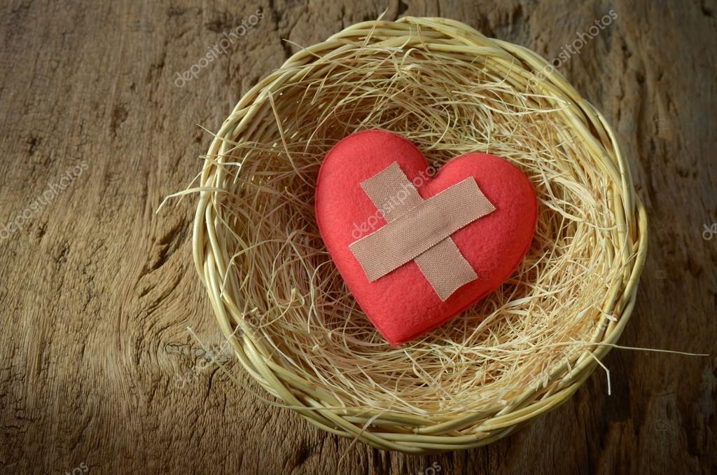 Wounded heart in basket — Stock Photo © kwanchaidp #71482833