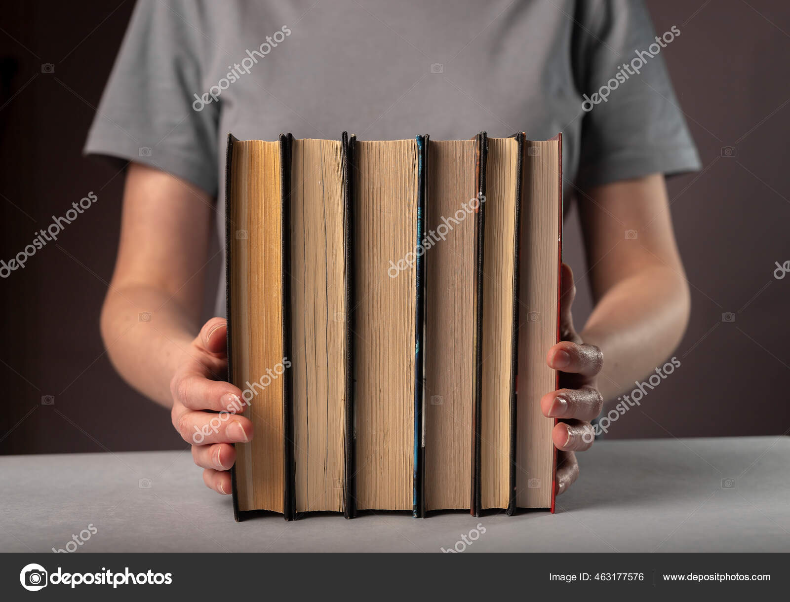 Book lover holding horizontal stack of books in hands, reader — Stock ...
