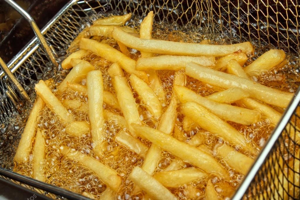 Cooking fries ⬇ Stock Photo, Image by © arskajuhani #65473759