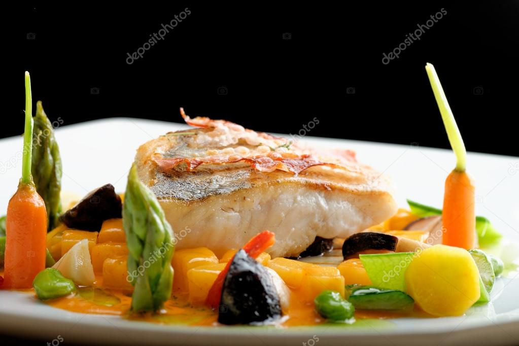 White fish fillet breaded in herbs with grilled bacon Stock Photo by ...