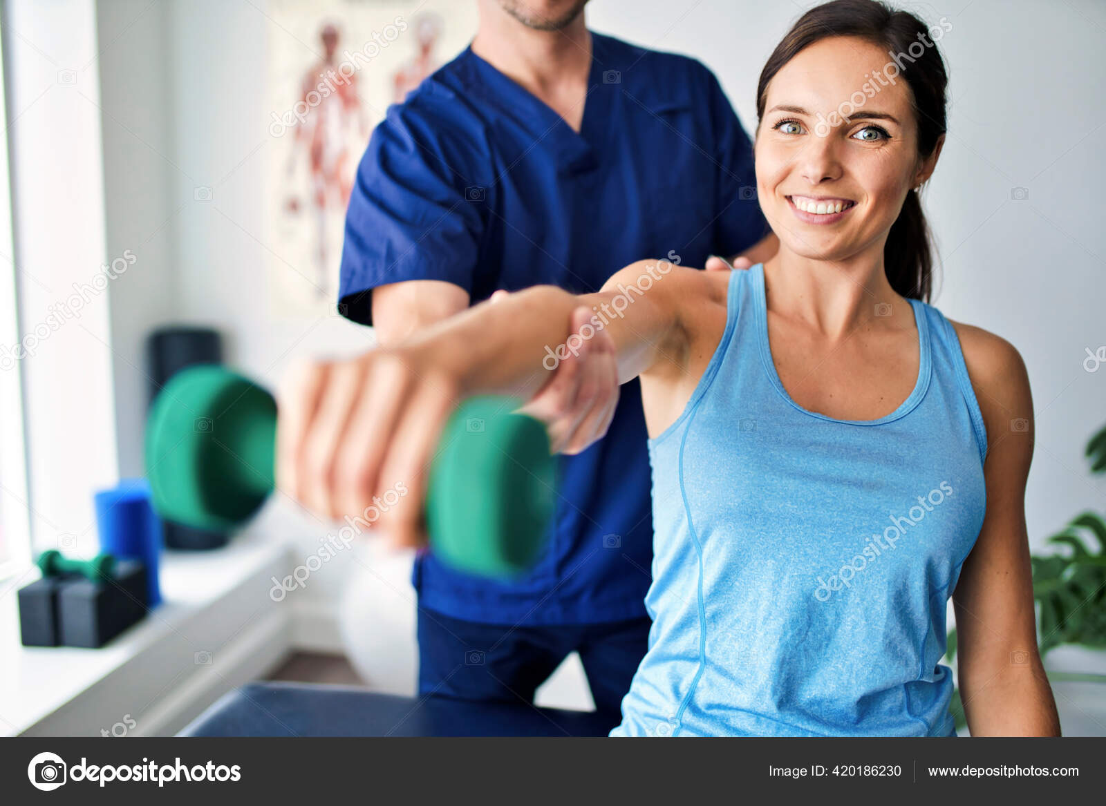 Male Physical Therapist Stretching a Female Patient Slowly. — Stock ...
