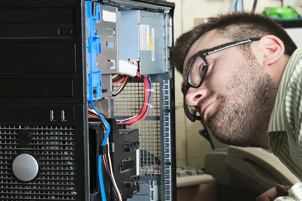 Worker technician at work with computer. - Stock Image - Everypixel