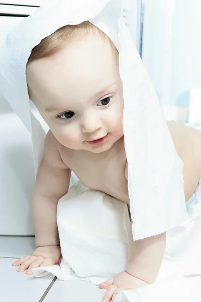 Toddler ripping up toilet paper in bathroom — Stock Photo © Lopolo ...
