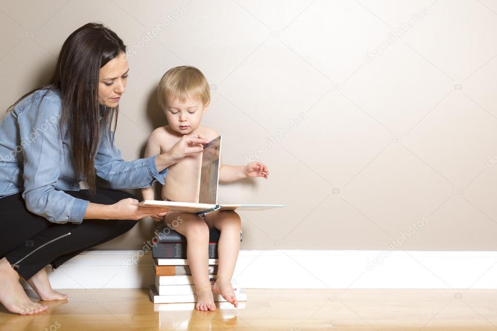 Mother reading with her son Stock Photo by ©Lopolo 90401926