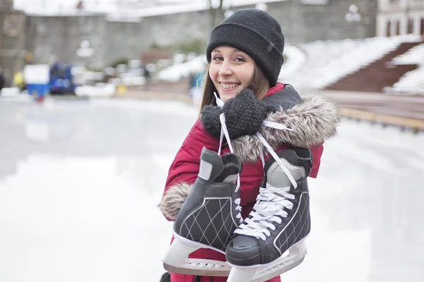 Ice skating couple having winter fun on ice skates Quebec, Canada ...
