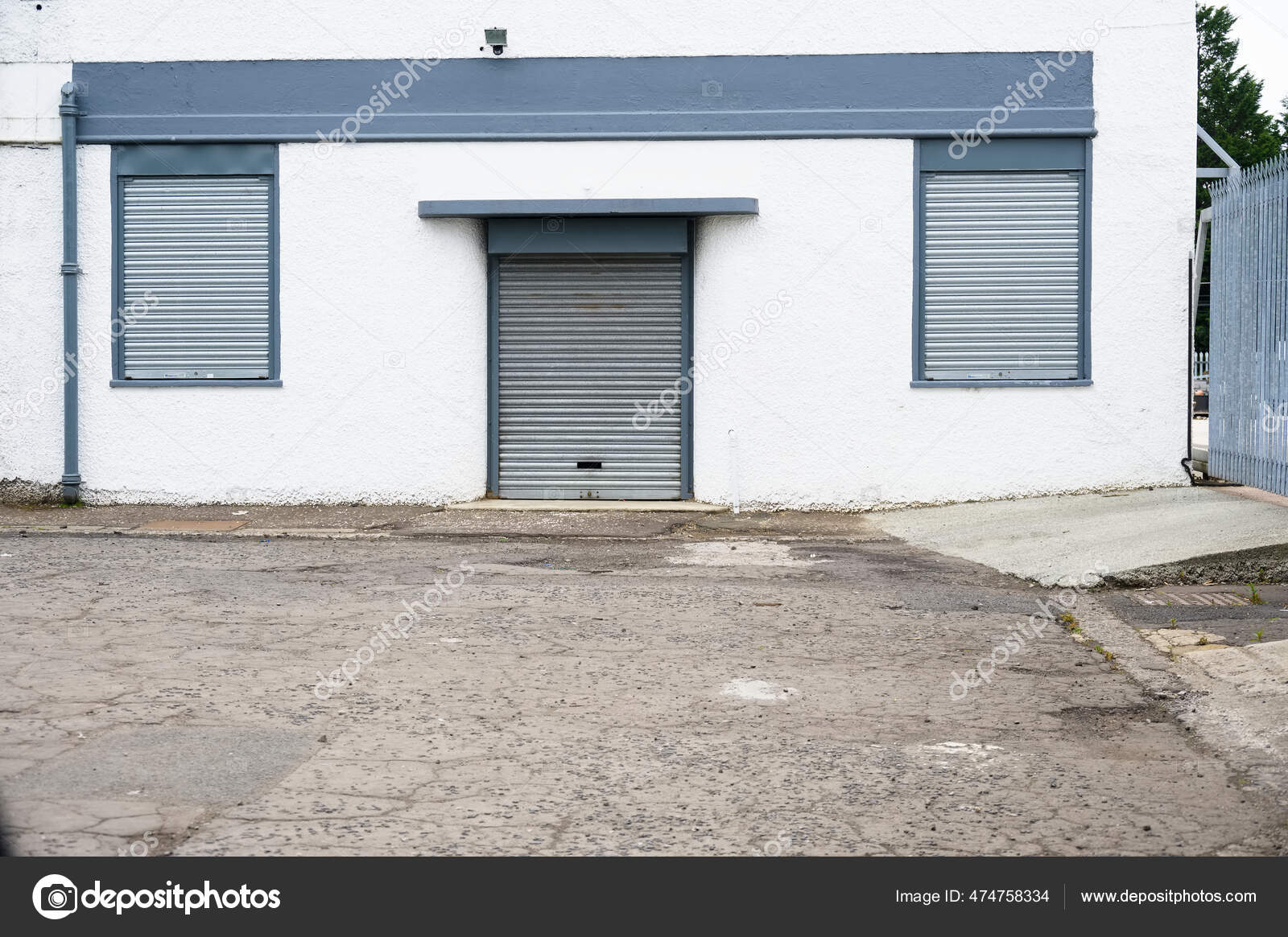 Shop front with blank sign and closed shutter door — Stock Editorial ...