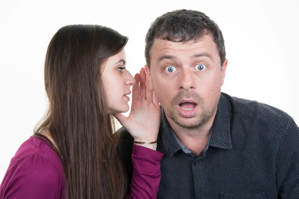Woman is whispering a secret into her friends ear Stock Photo by ...
