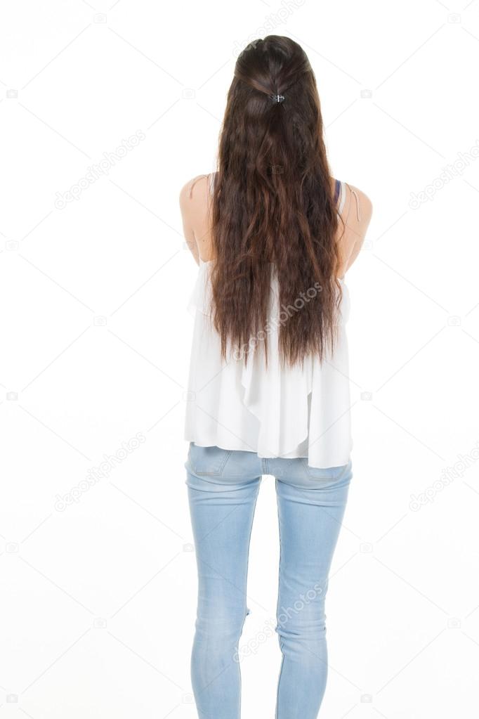 Attractive slim woman posing in jean trousers, back view Stock Photo by ...