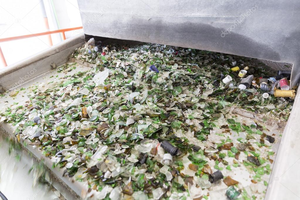 Glass waste in recycling facility. Glass particles in a machine — Stock ...