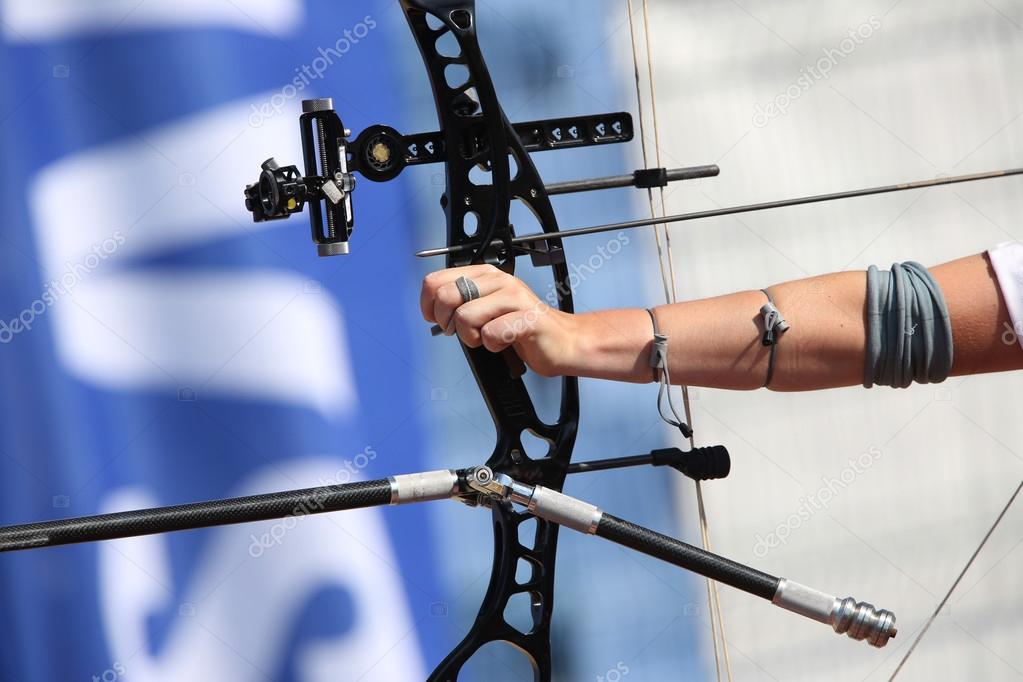 Bow and arrow in the hands of an archer Stock Photo by ©Belish 56946101