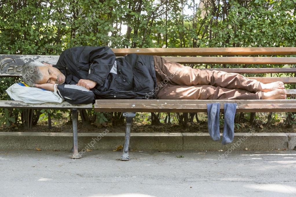 Image Two Homeless People Lying On A Bench