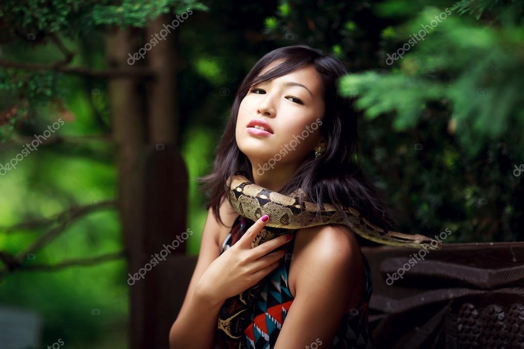 Woman with snake — Stock Photo © castenoid #61286317