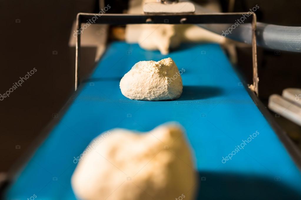 Bread moving on a conveyor belt. Stock Photo by ©Denisfilm 103715248