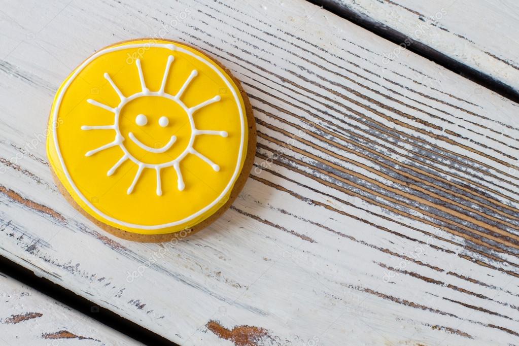 Cookie with smiling sun picture. Stock Photo by ©Denisfilm 124332502