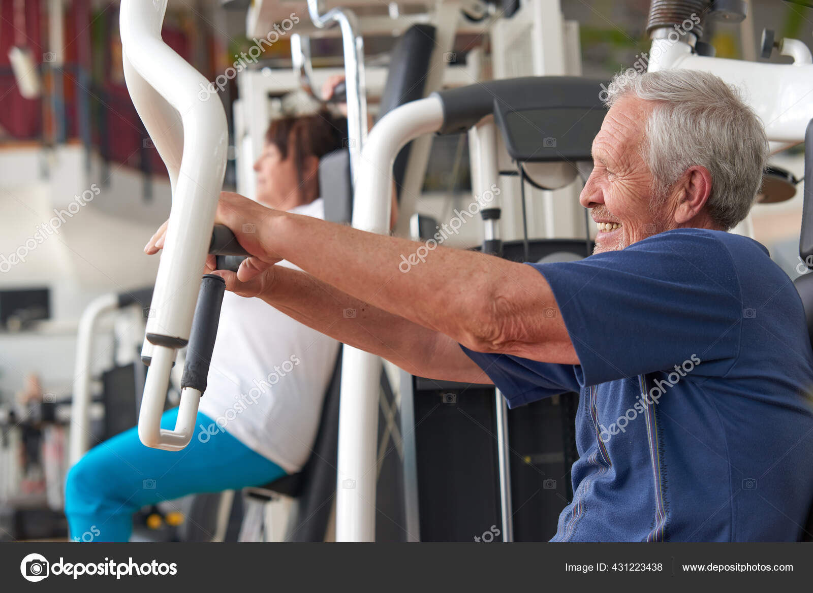 Older man training on press machine at gym club. Stock Photo by ...