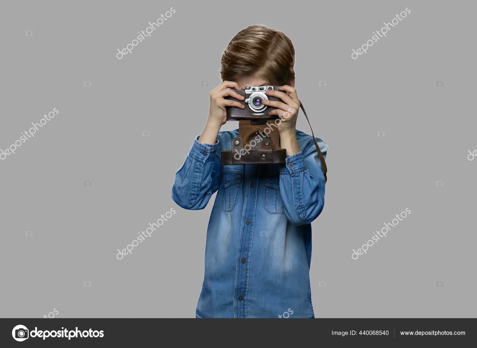 Little boy using old retro camera. Stock Photo by ©Denisfilm 440068540