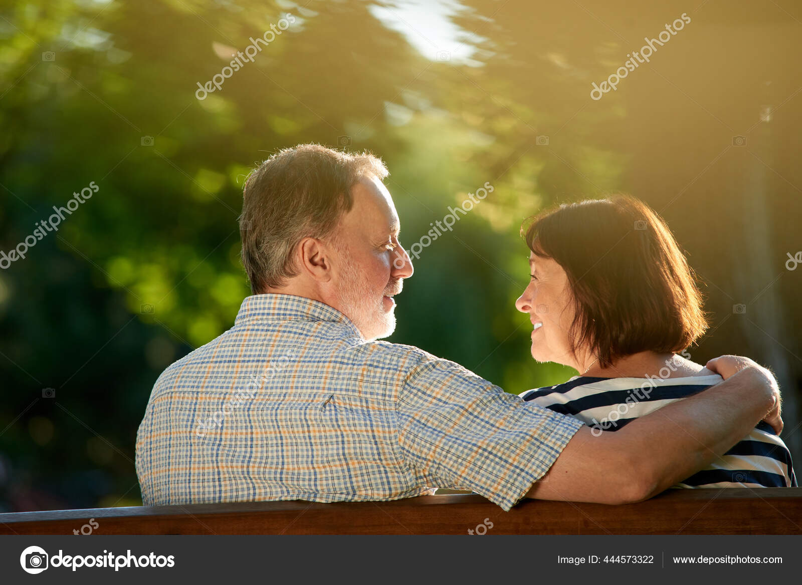 Back view loving couple sitting in the park. Stock Photo by ©Denisfilm ...