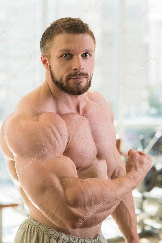 Strong muscular man. — Stock Photo © Denisfilm #95330720