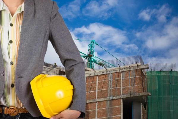 Engineer holding yellow helmet — Stock Photo © nirutdps #53043573